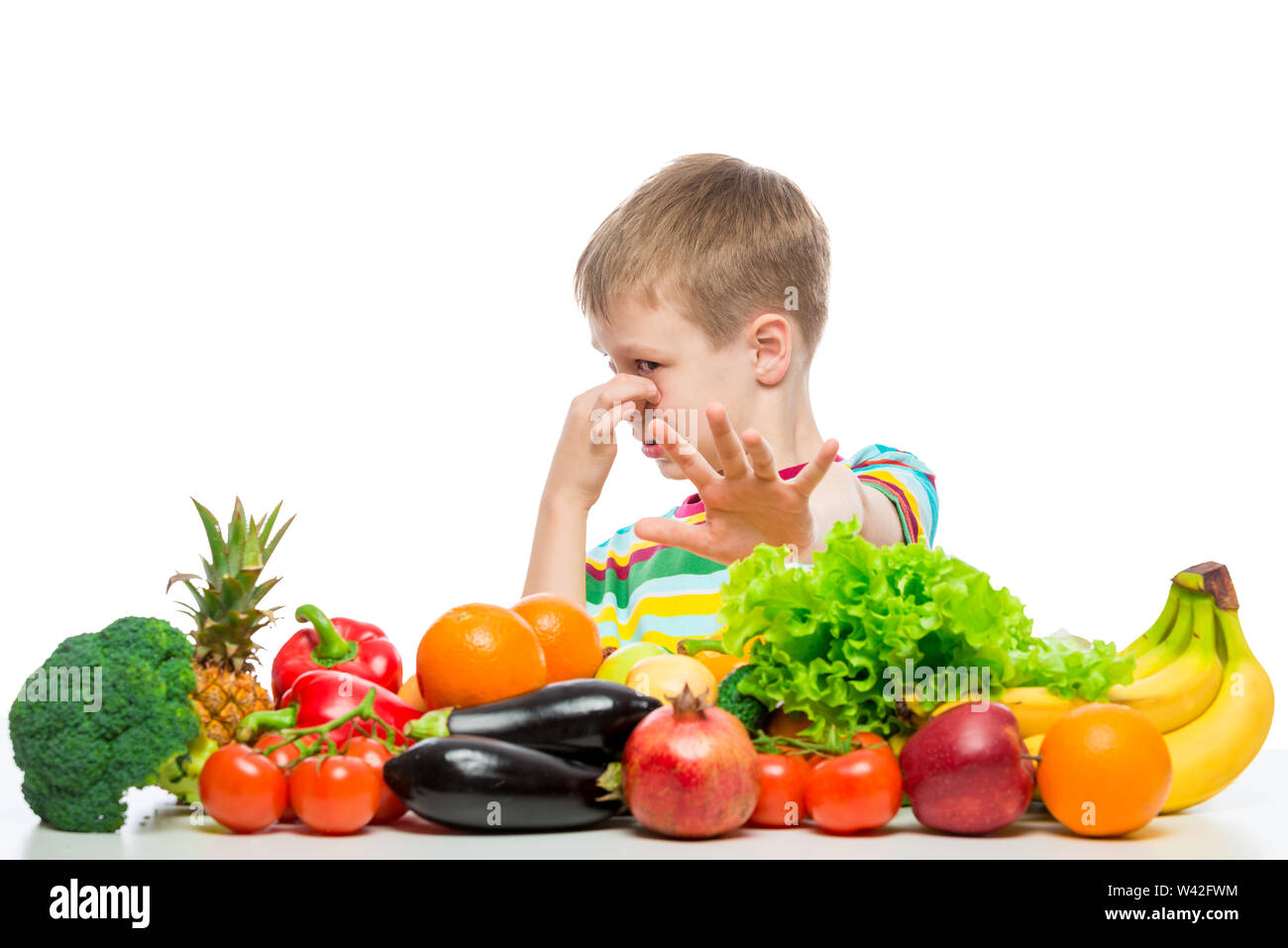 Boy and vegetables, unloved food concept photo Stock Photo - Alamy