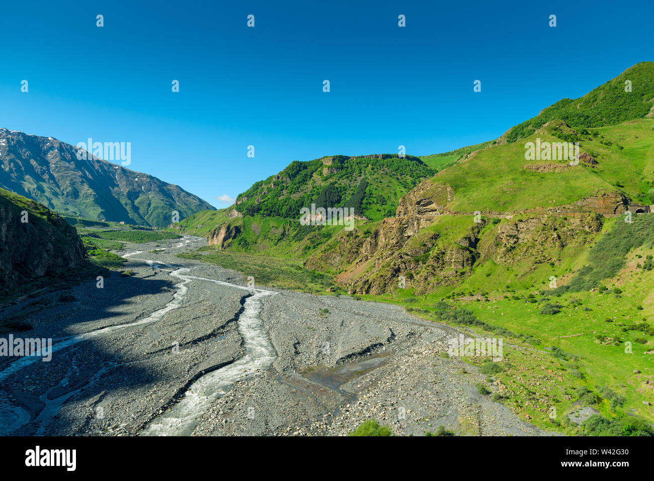 Blue sky over the high scenic Caucasus Mountains in Georgia on the ...