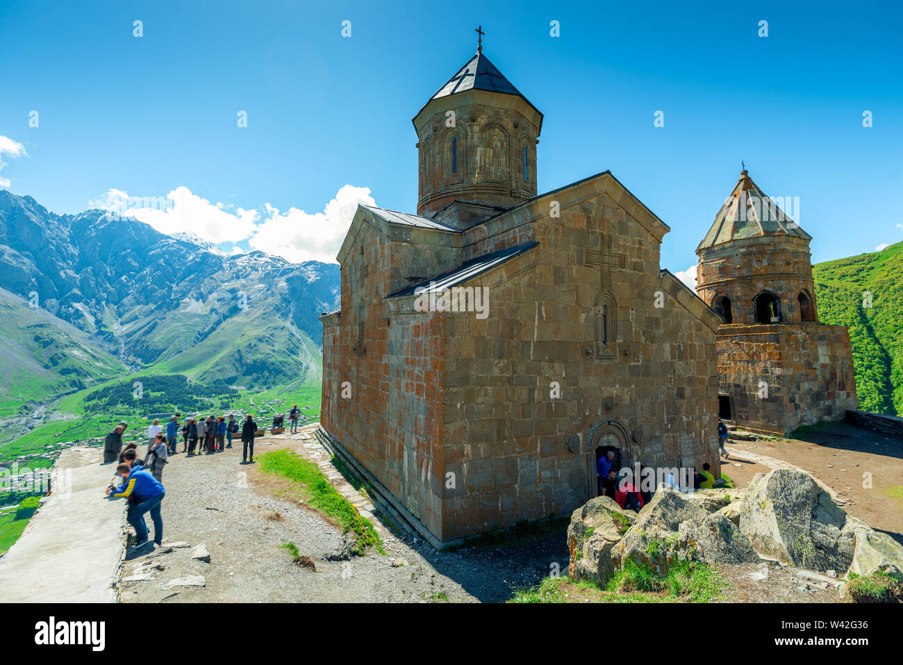 The magnificent sight Trinity Church above the village Gergeti in ...