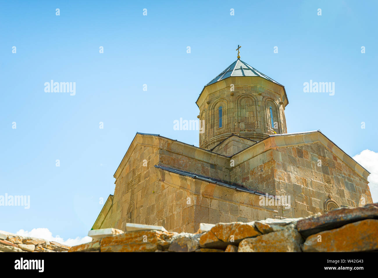 view of the Trinity Church in Georgia near the village of Gergeti Stock ...
