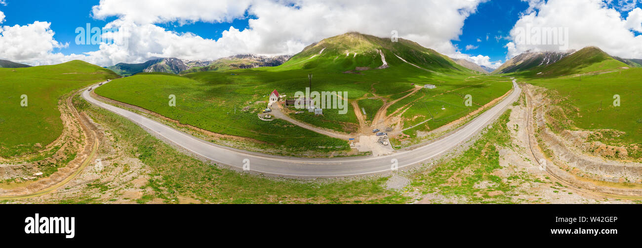 winding Georgian Military Road surrounded by mountains landscape ...