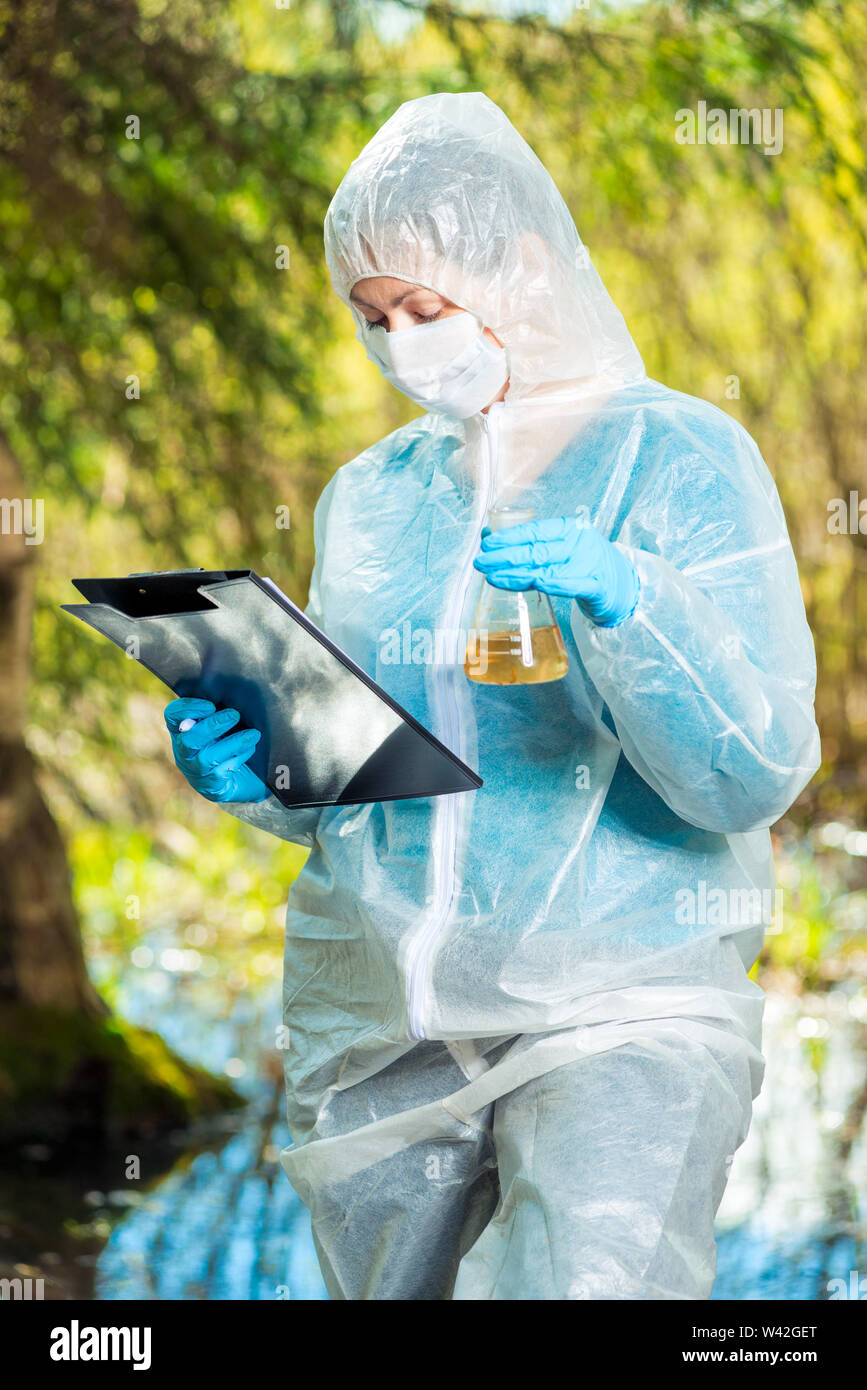 work of an ecologist in nature, research of contaminated water in a ...