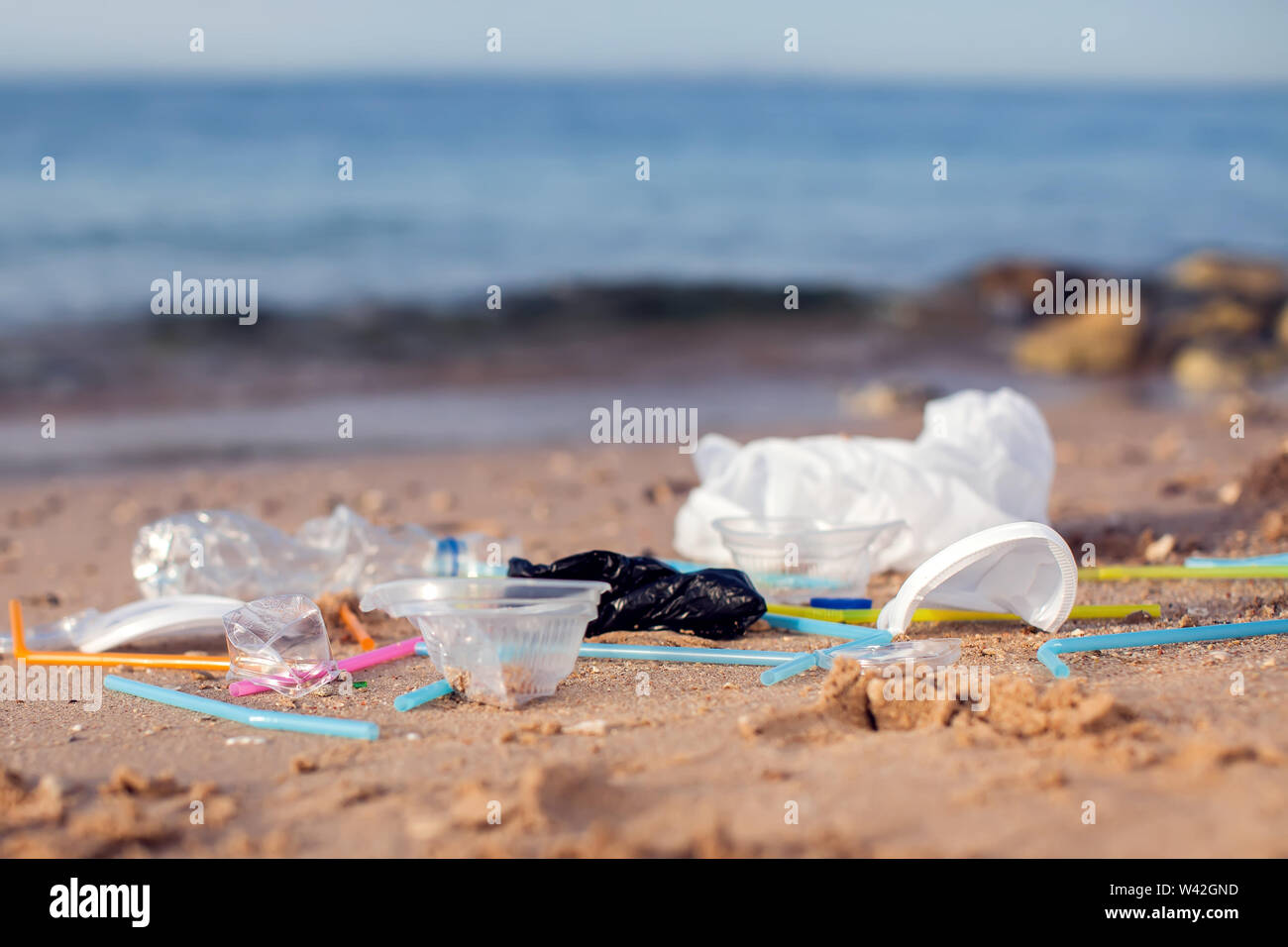 Different Garbage on the beach. Environmental pollution concept Stock ...