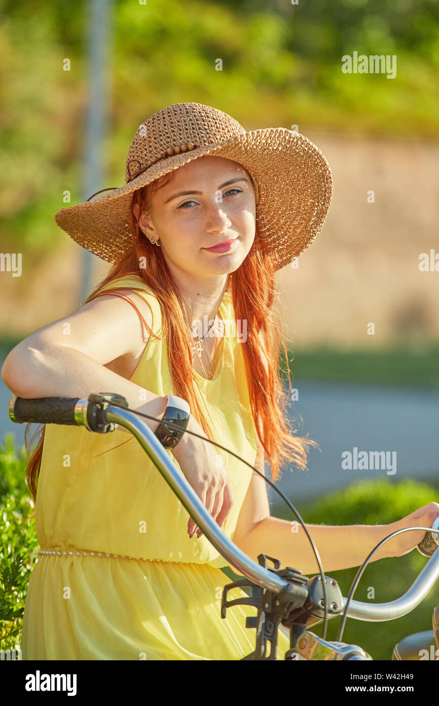 Woman red hair bike hi-res stock photography and images - Alamy