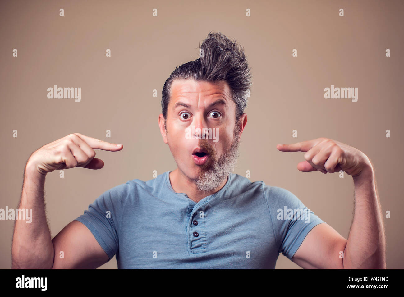 A portrait of man with half beard and hair on brown background Stock ...
