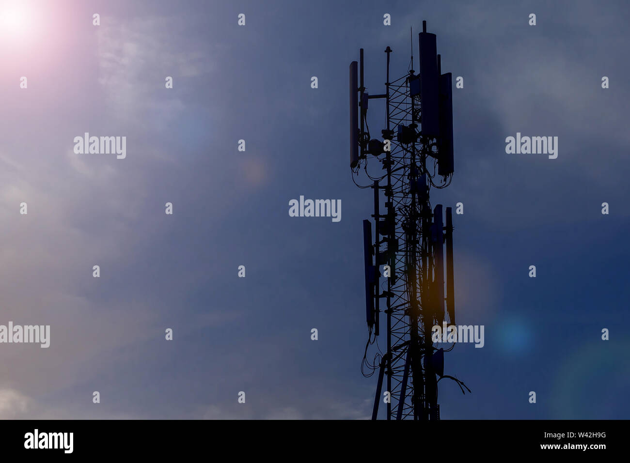 Cellular telecom pole high tower 3G 4G 5G , with blue sky and clouds ...
