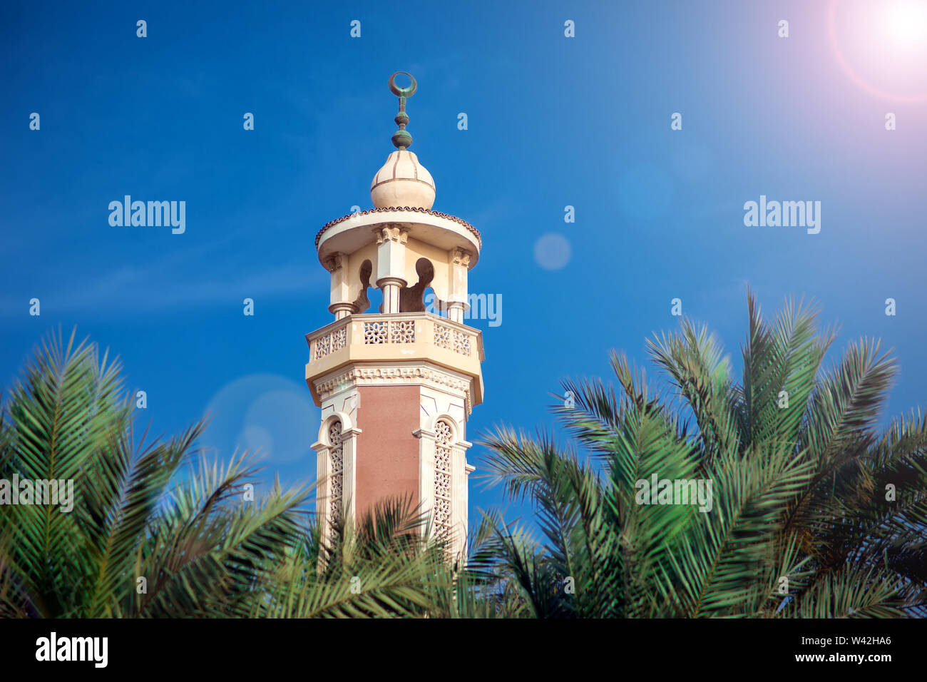 Beautiful white mosque in the sunlight and blue sky background Stock ...