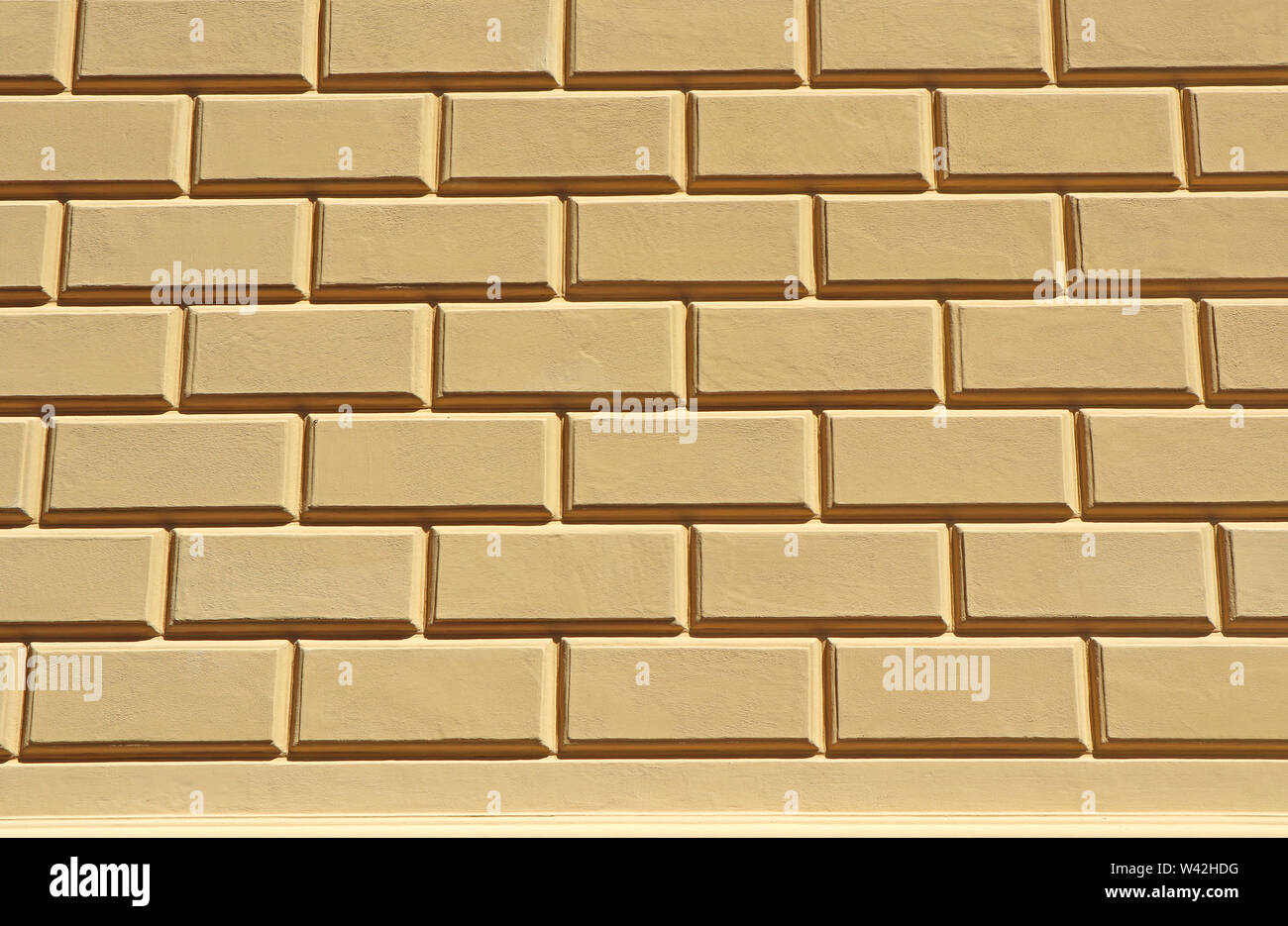 Yellow brick wall pattern Stock Photo - Alamy