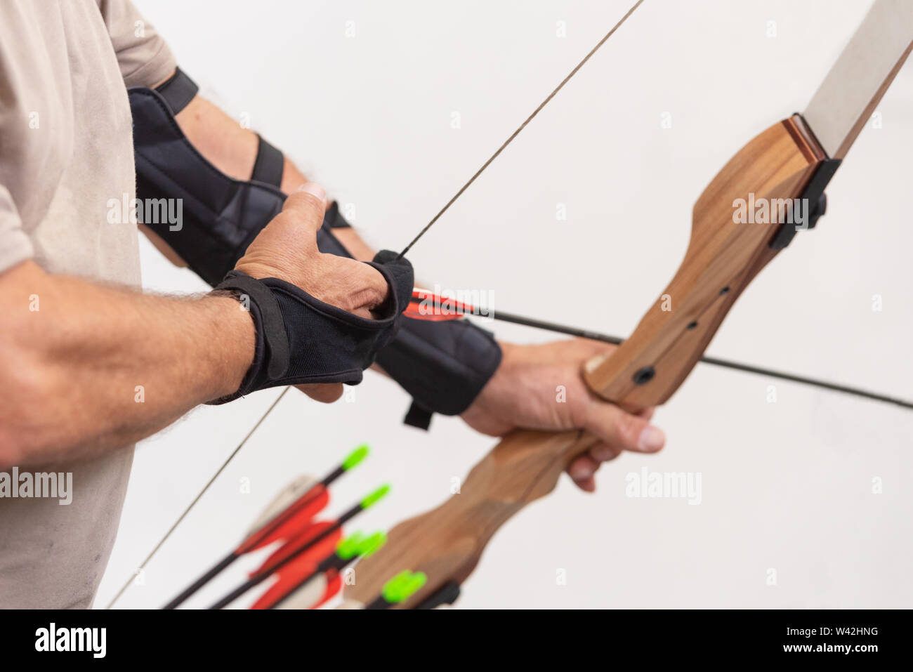 Archer hands close up, preparing the arrow for the shot Stock Photo - Alamy