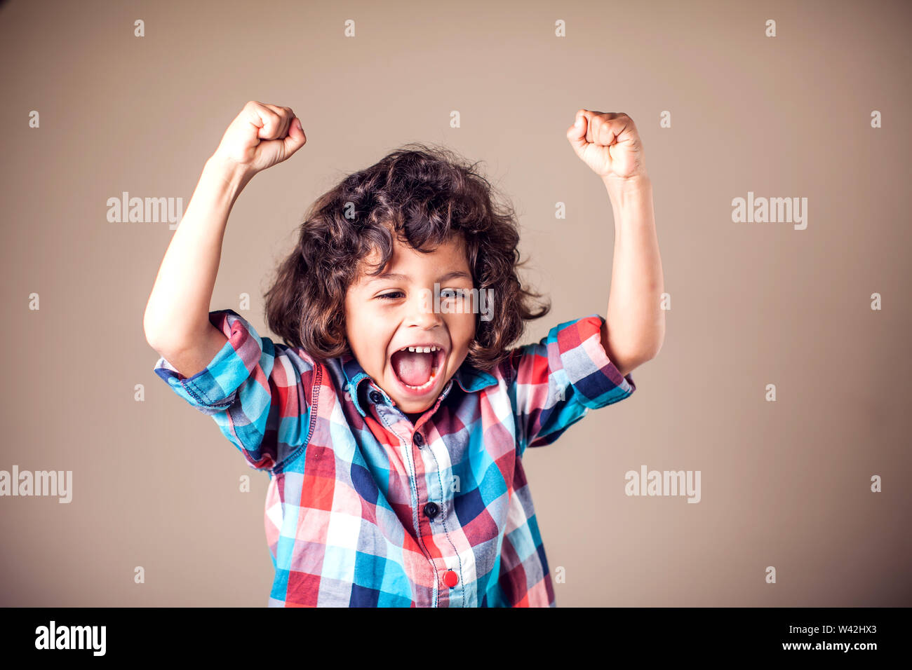 Kid boy rejoice at something. People, emotions and childhood lifestyle ...