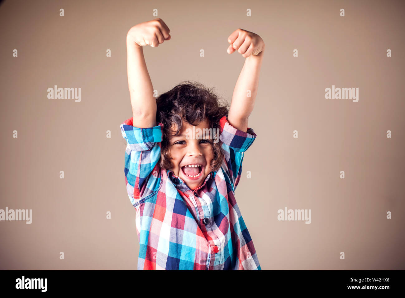 Kid boy rejoice at something. People, emotions and childhood lifestyle ...