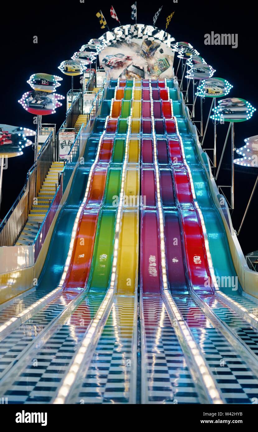 Low shot of colorful water slides at the park during a carnival at ...