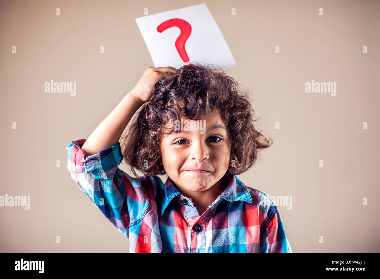 Kid boy with question mark. Children, education, emotions concept Stock ...