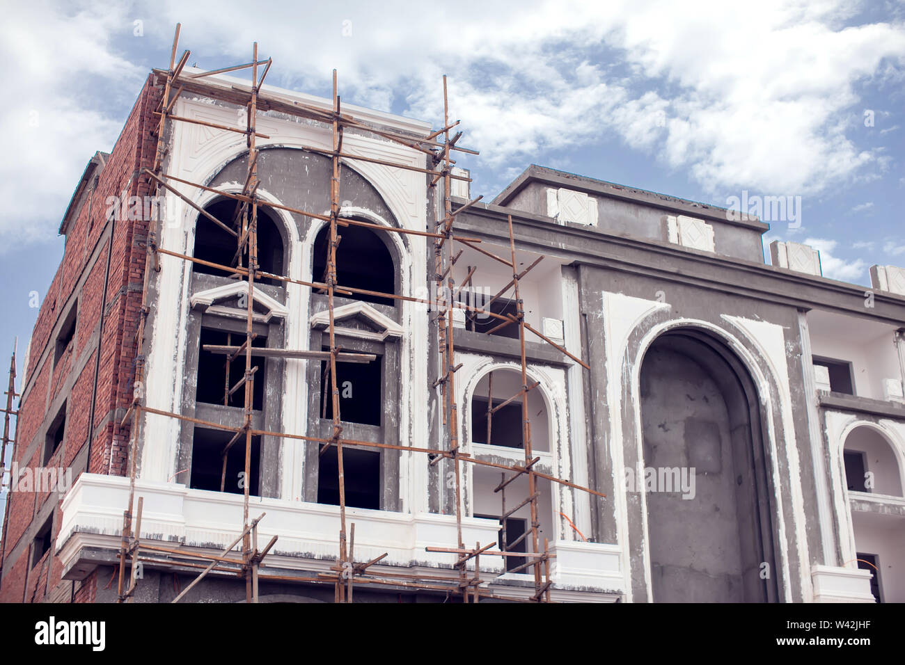 House with wooden scaffolding construction. Architecture and building ...