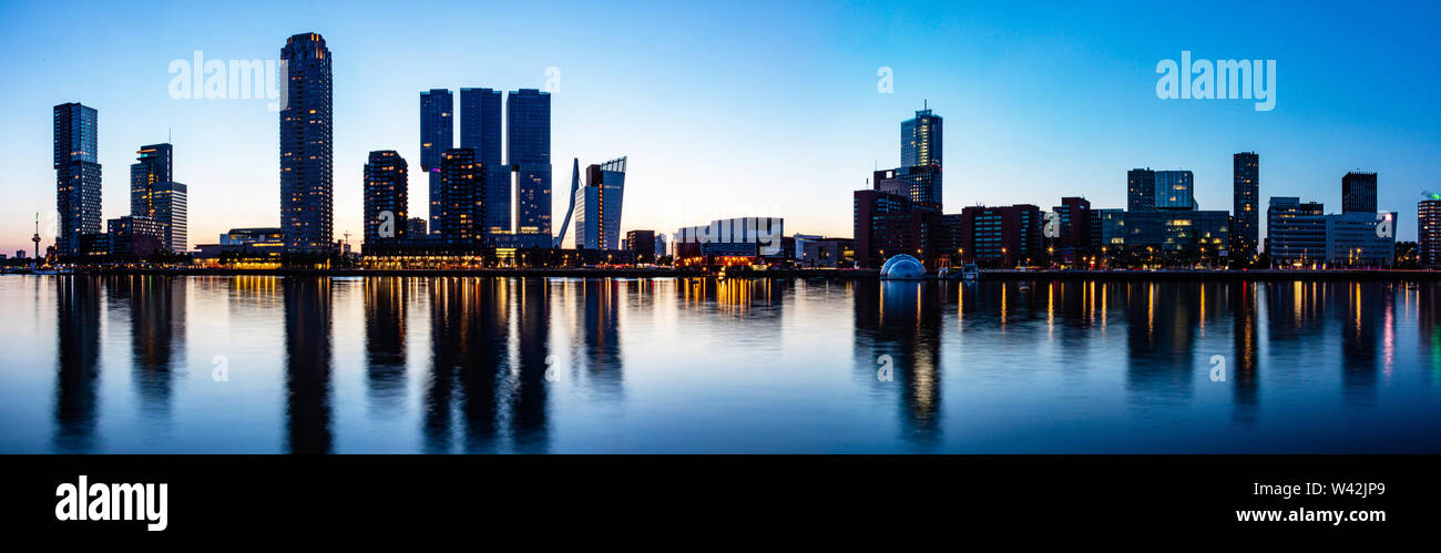 Rotterdam skyline night panoramic view. City towers illuminated ...