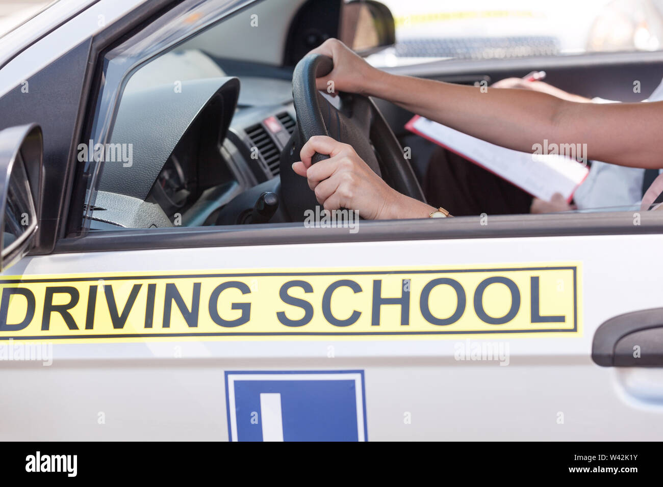 Learning to drive a car. Driving school. Driver education Stock Photo ...