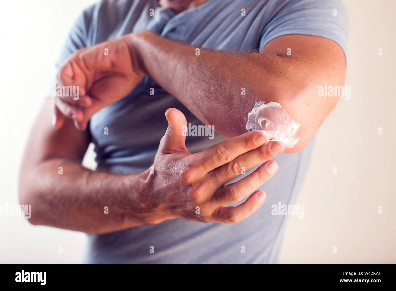 Person applies cream on hand hi-res stock photography and images - Alamy
