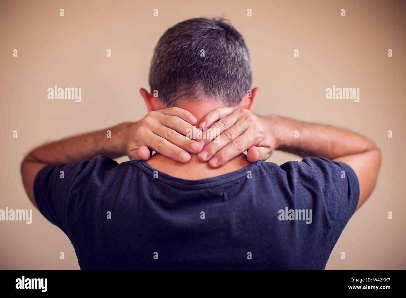 Man feels strong neck pain isolated. People, healthcare and medicine ...