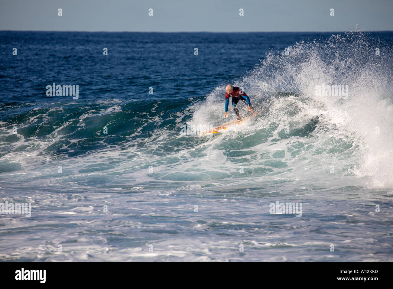Middle aged australian male surfing off the coast of Sydney on a ...