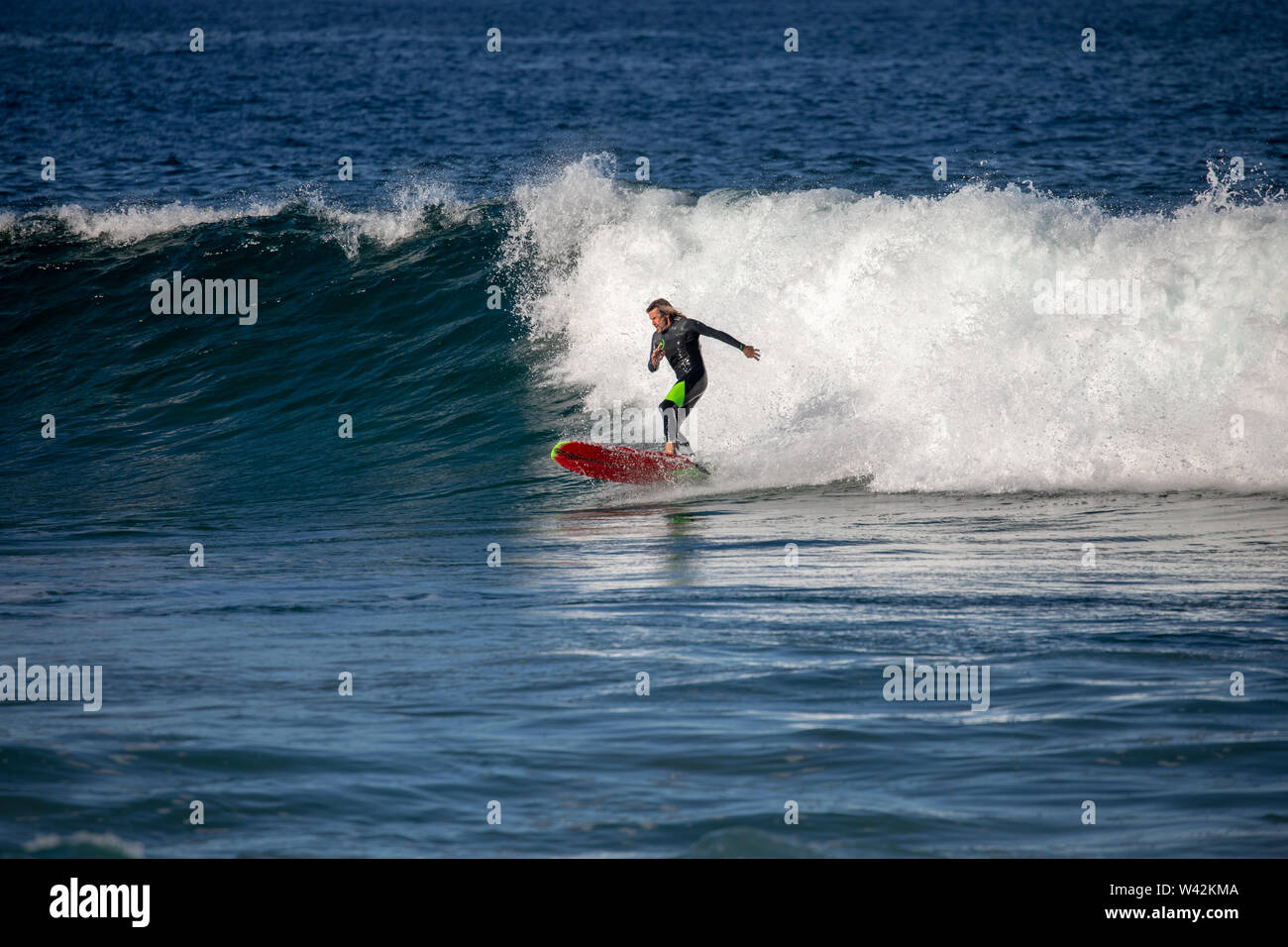 Surfing in Australia, man surfs on a winters day afternoon on Sydney ...