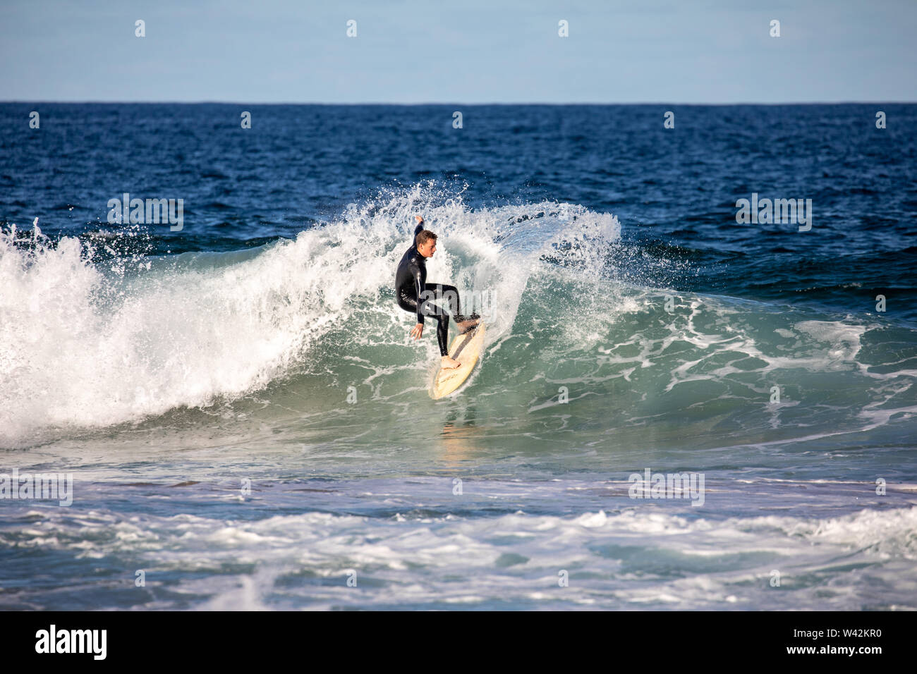 Surfing in Australia, man surfs on a winters day afternoon on Sydney ...