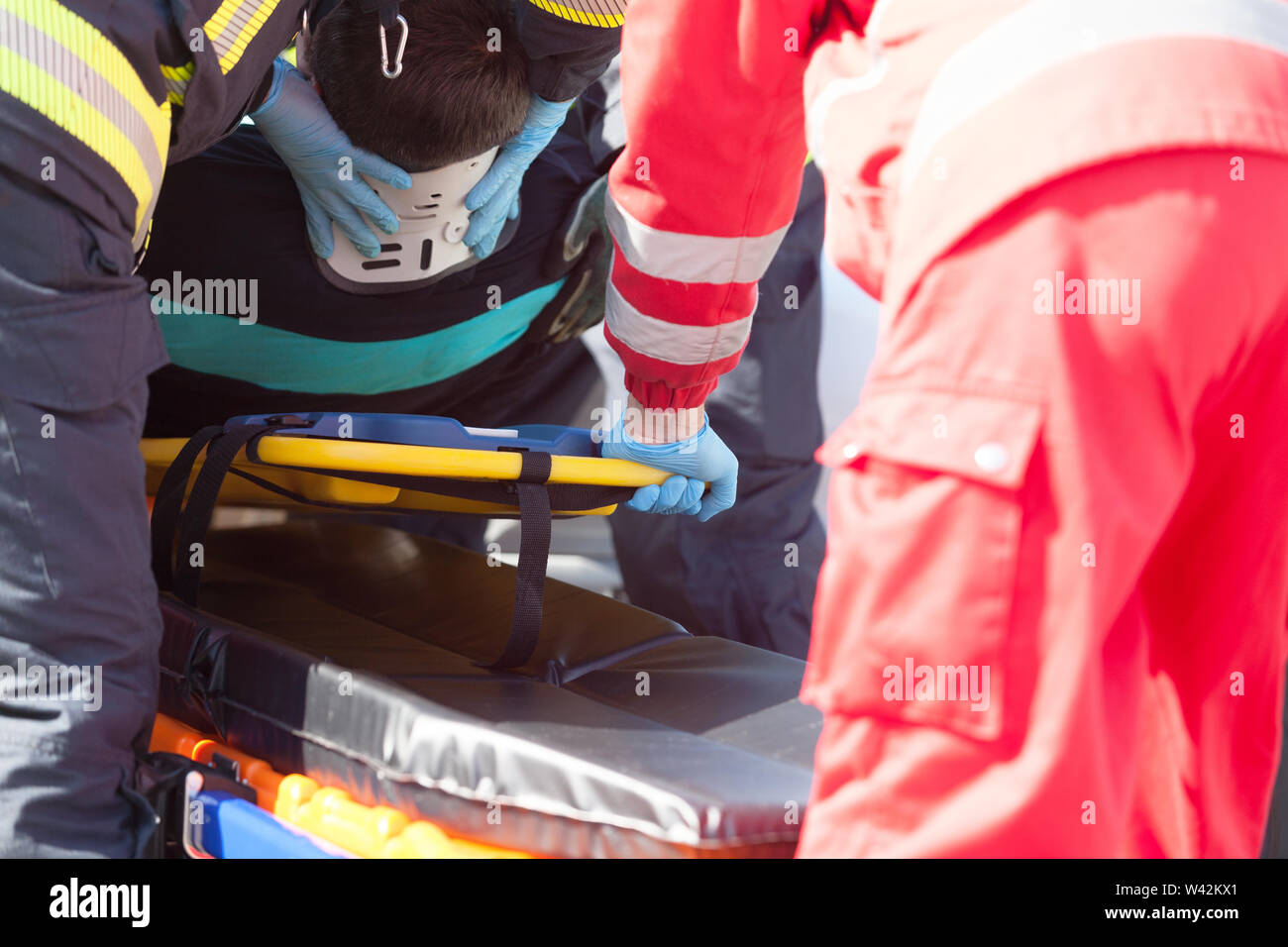 Paramedics and firefighters in urgent rescue operation after a car ...