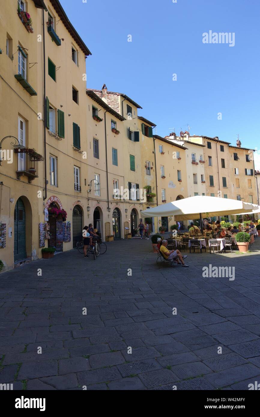 Lucca, Italy - Famous Piazza Anfiteatro in the northeast quadrant of ...