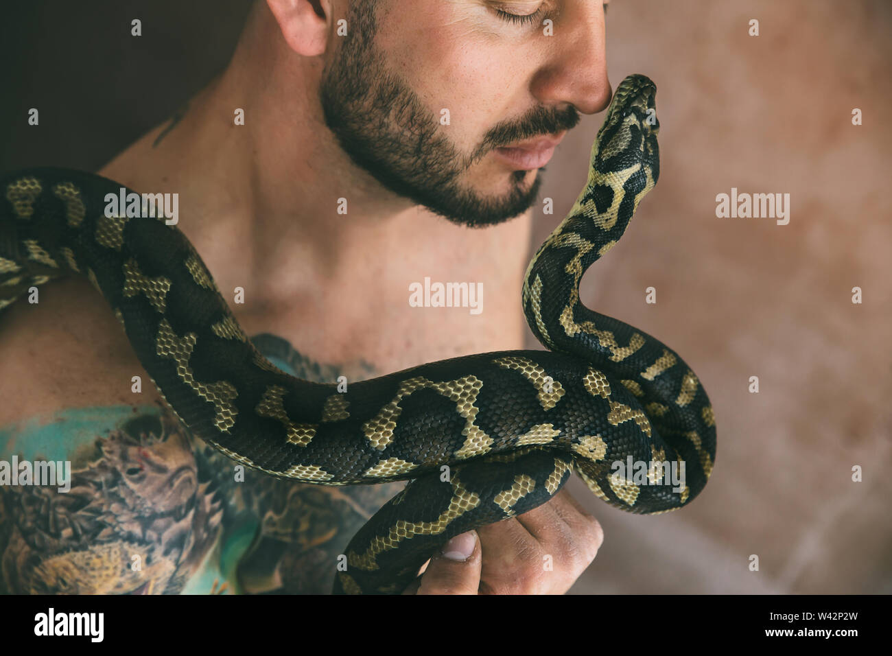 Person with a snake hi-res stock photography and images - Alamy
