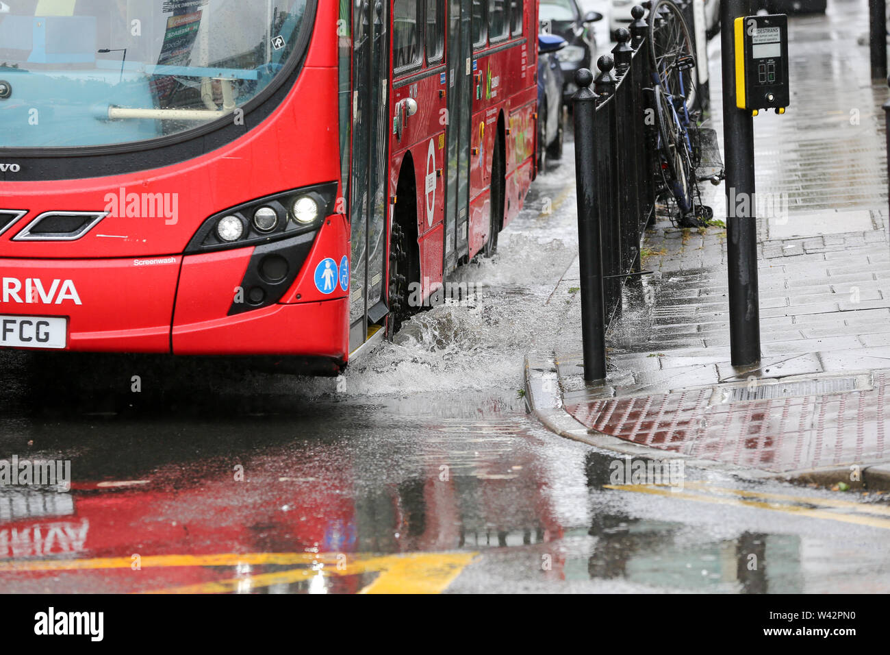 Bus drives through rain water hi-res stock photography and images - Alamy