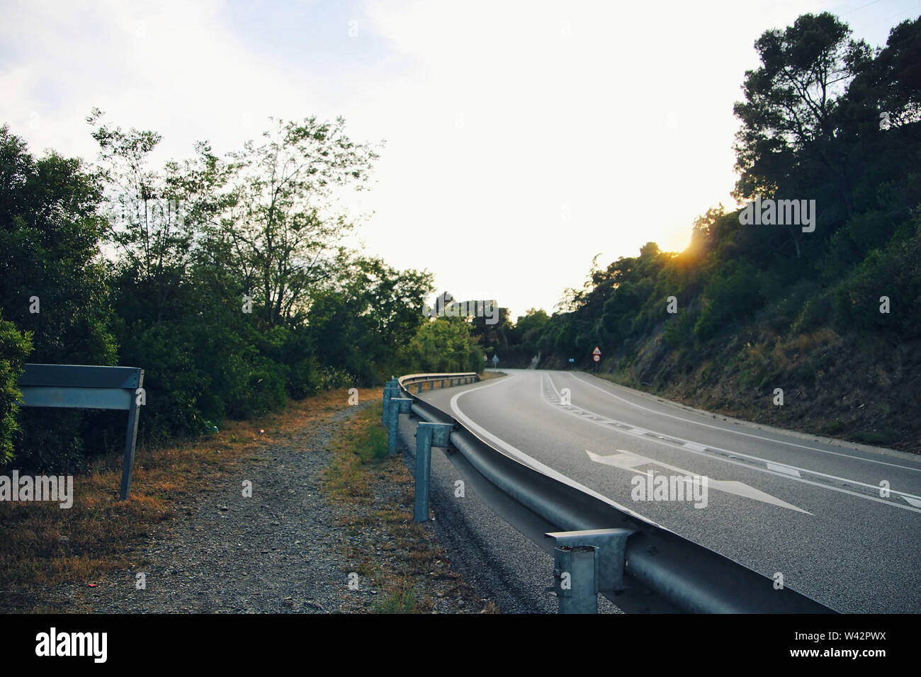 Sunset on country road with tree hi-res stock photography and images ...
