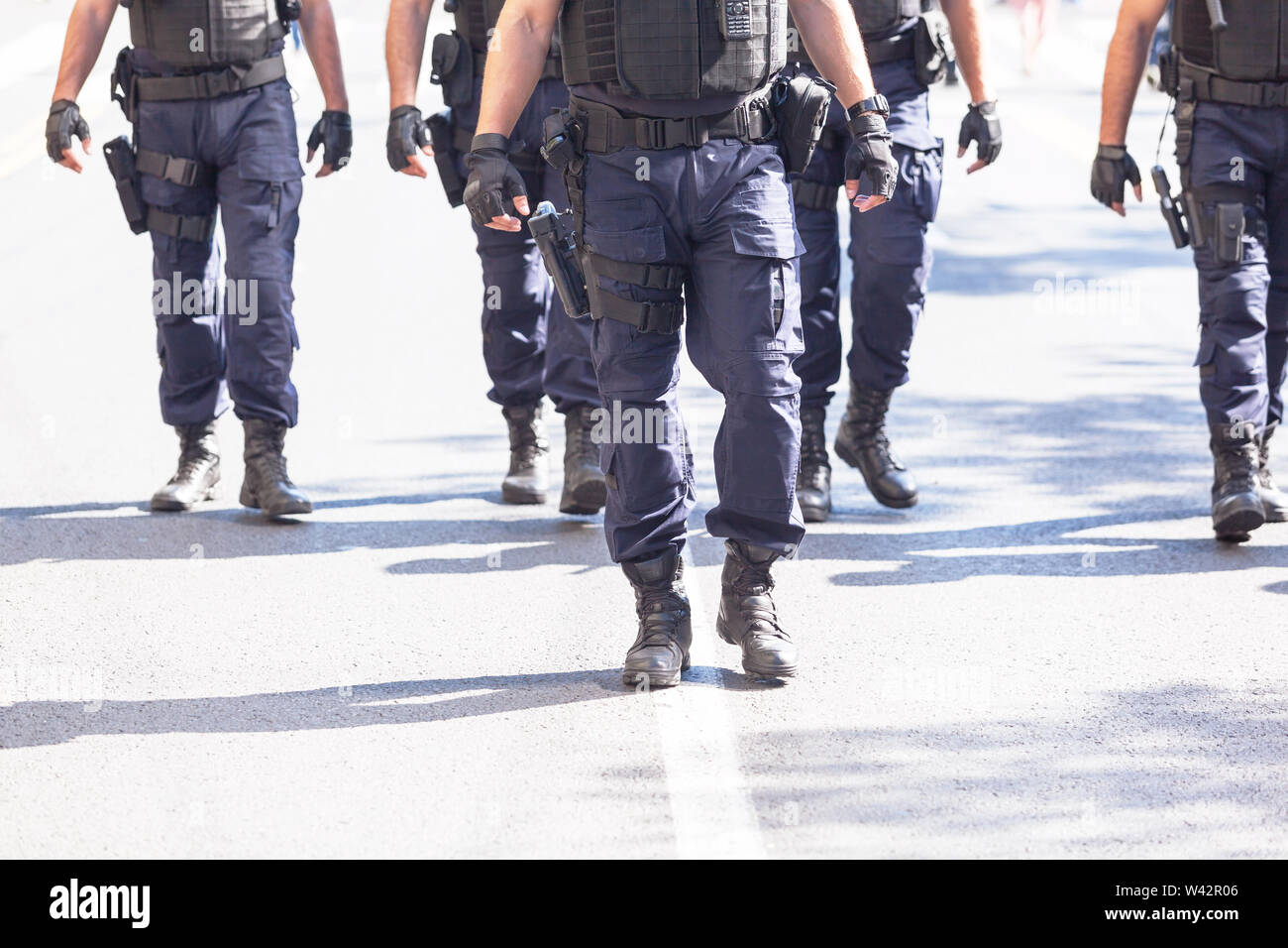 Policeman on duty patrolling street hi-res stock photography and images ...