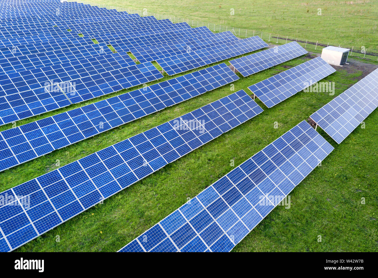 Large field of solar photo voltaic panels system producing renewable ...