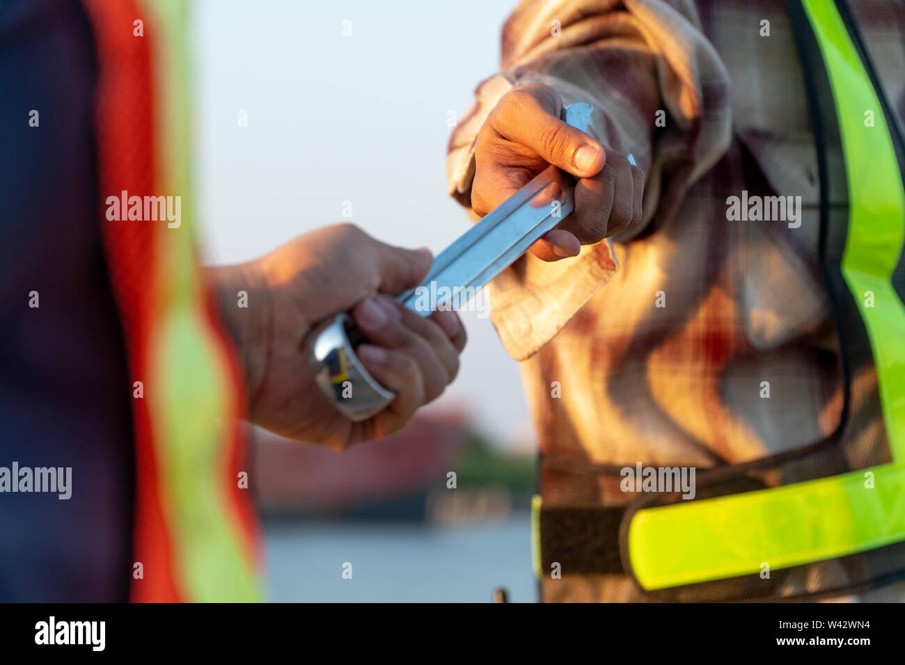 Engineers are submitting equipment to workers. Concepts of teamwork and ...