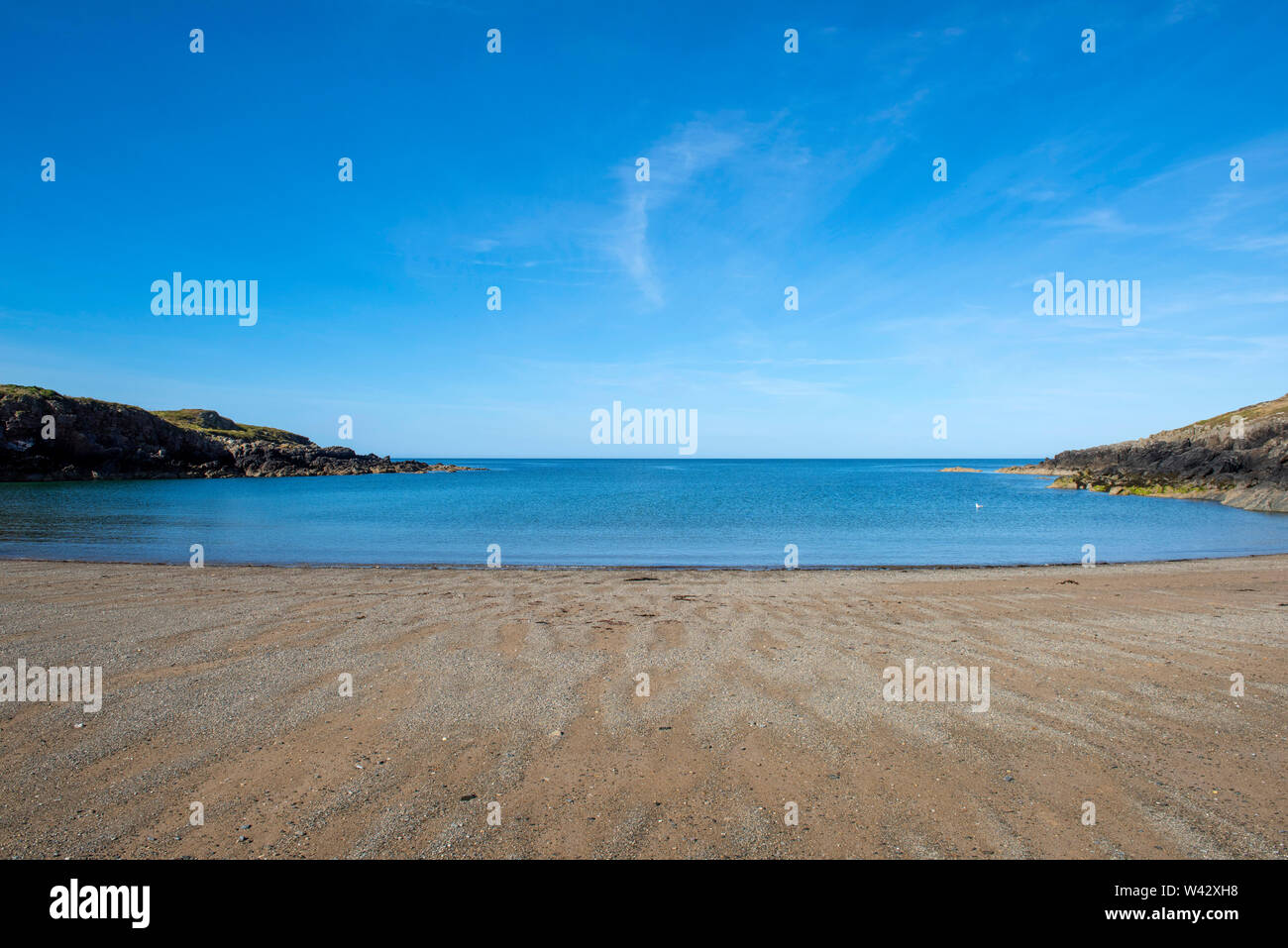 Summer morning at Cable Bay in Anglesey Wales UK Stock Photo - Alamy