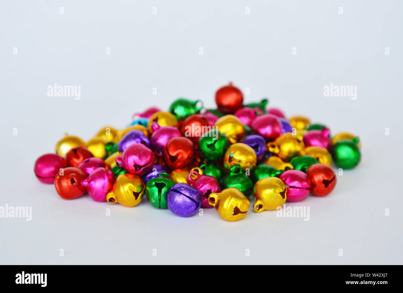 colorful bell on white background Stock Photo - Alamy