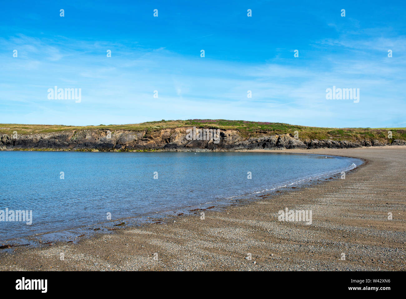 Summer morning at Cable Bay in Anglesey Wales UK Stock Photo - Alamy