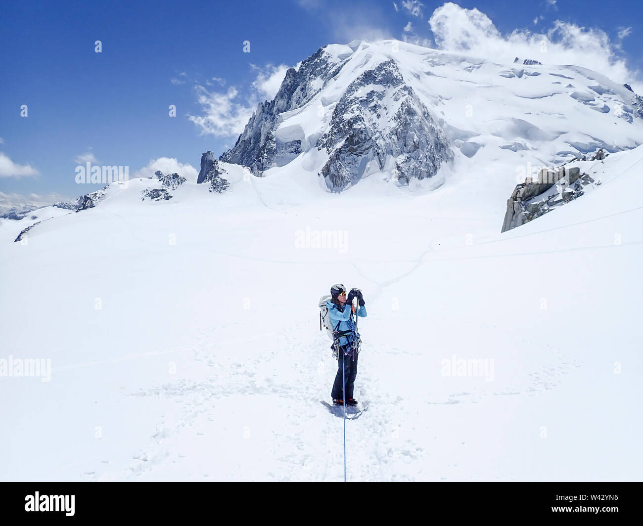 Alpinist on peak hi-res stock photography and images - Alamy