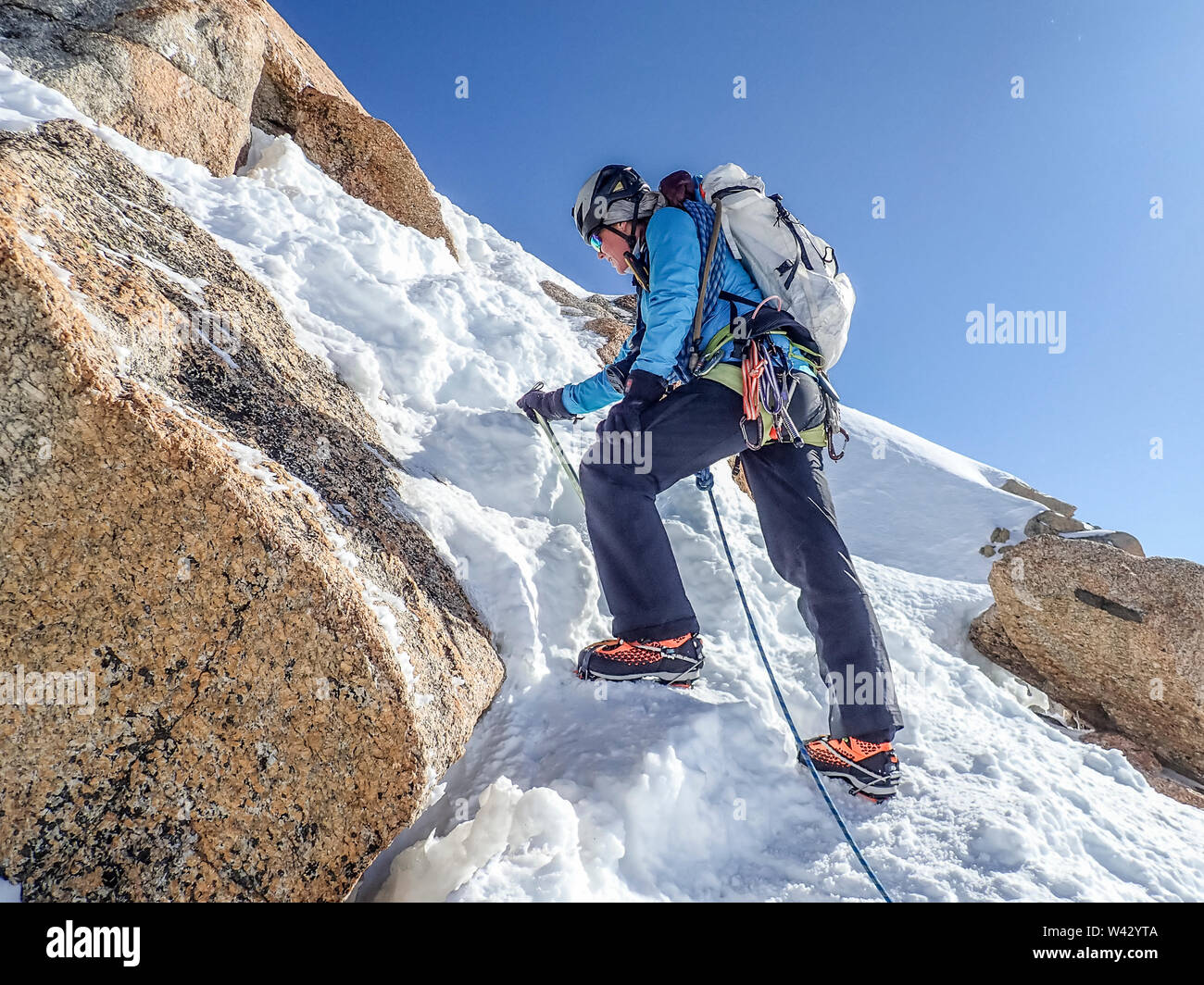 Mountaineer climbing up steep hi-res stock photography and images - Alamy