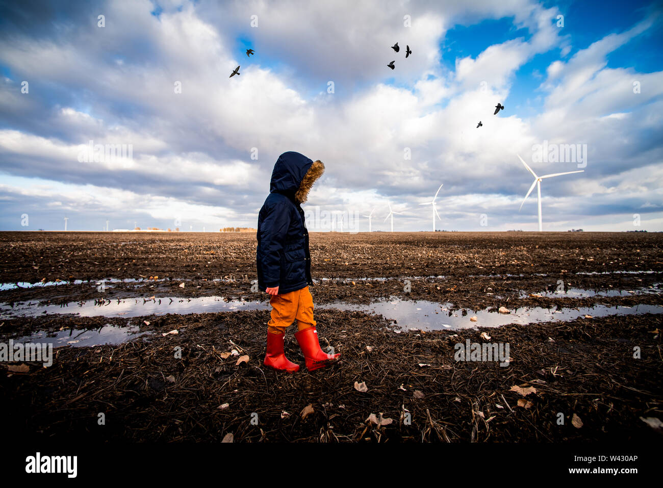 Child walking through mud hi-res stock photography and images - Alamy