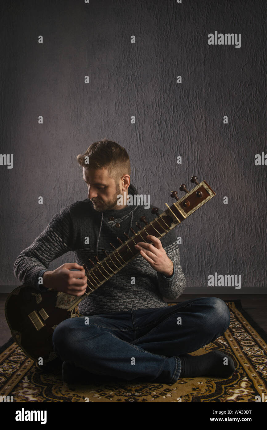Indian men playing musical instrument hi-res stock photography and ...