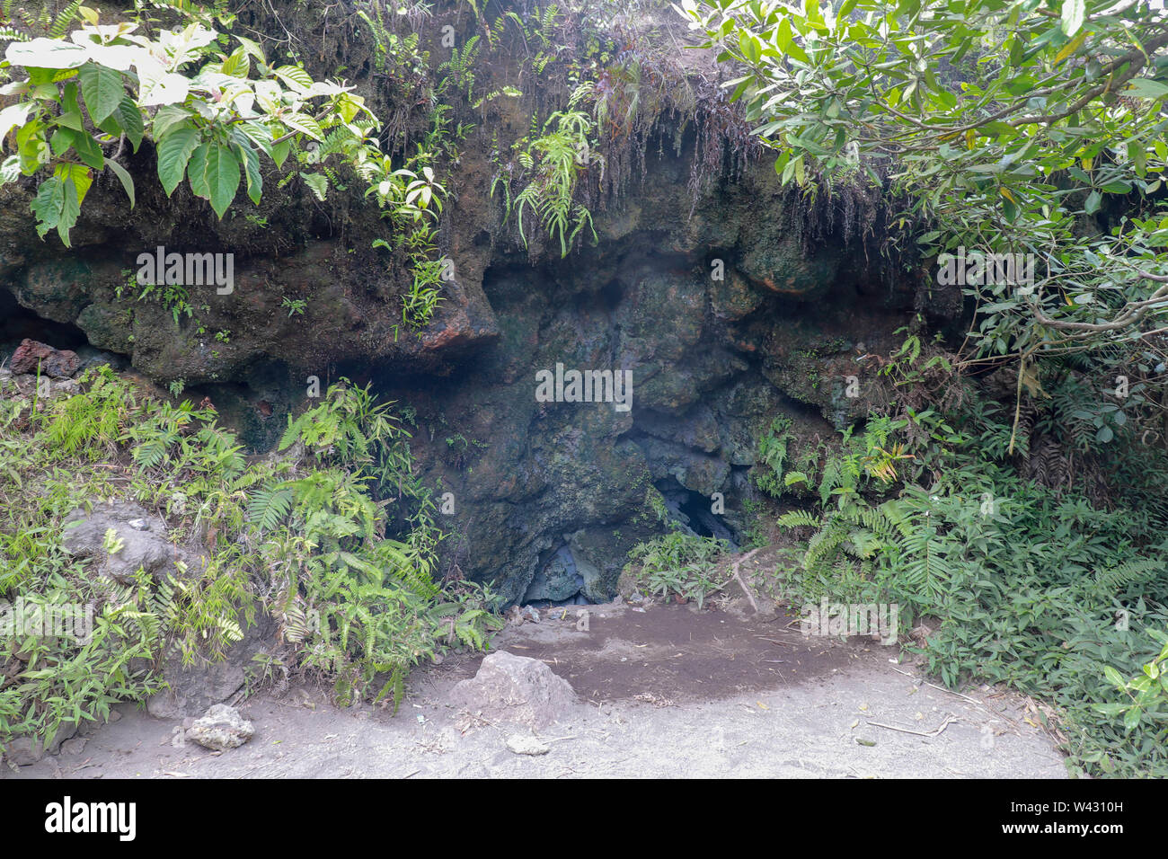 Volcanic chimney with escaping smoke and gases on the crater wall of ...