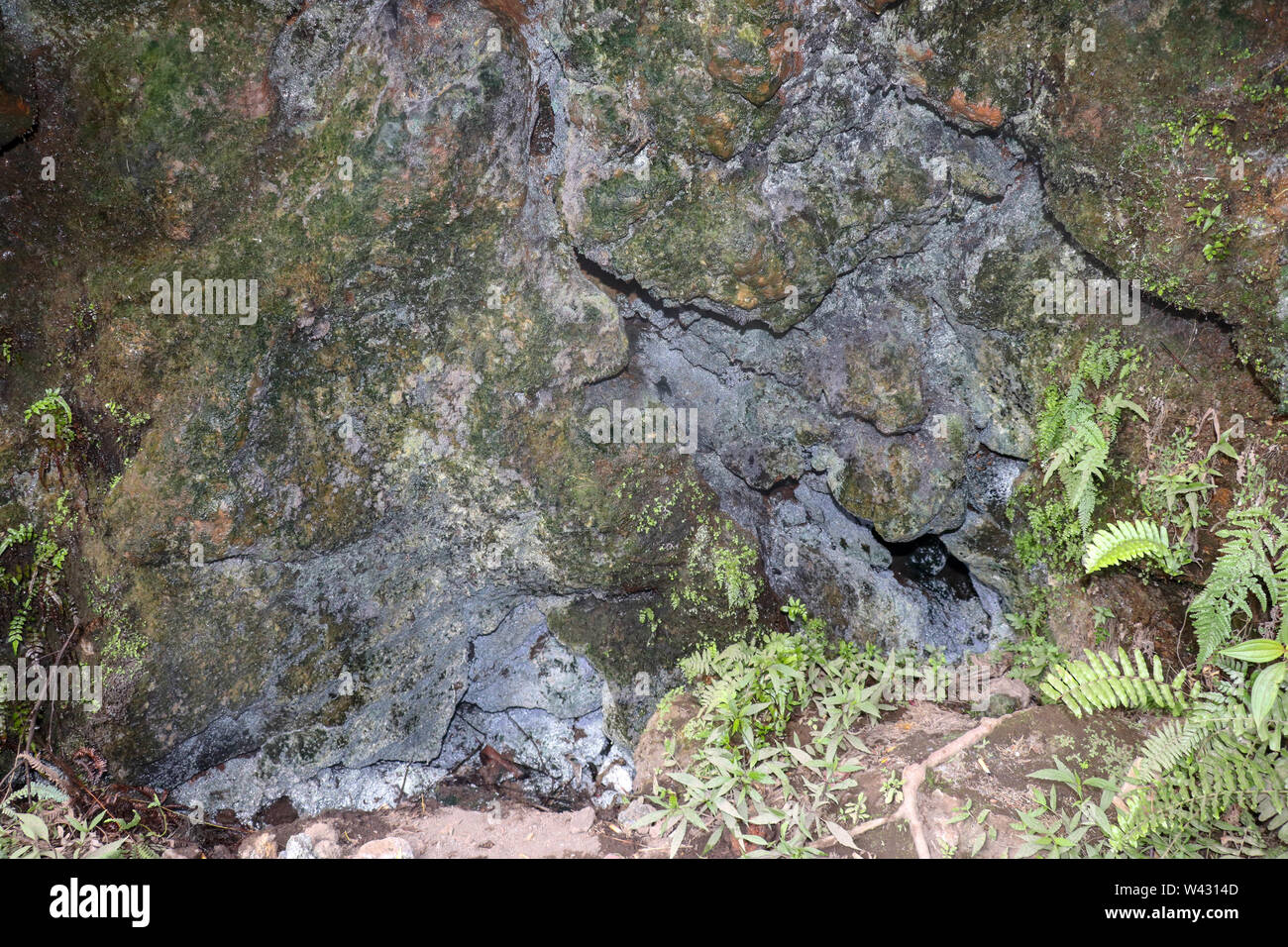 Volcanic chimney with escaping smoke and gases on the crater wall of ...