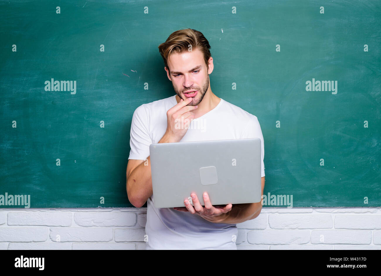Handsome man use modern technology. Digital technology. Apply online ... Handsome man use modern technology. Digital technology. Apply online ...
