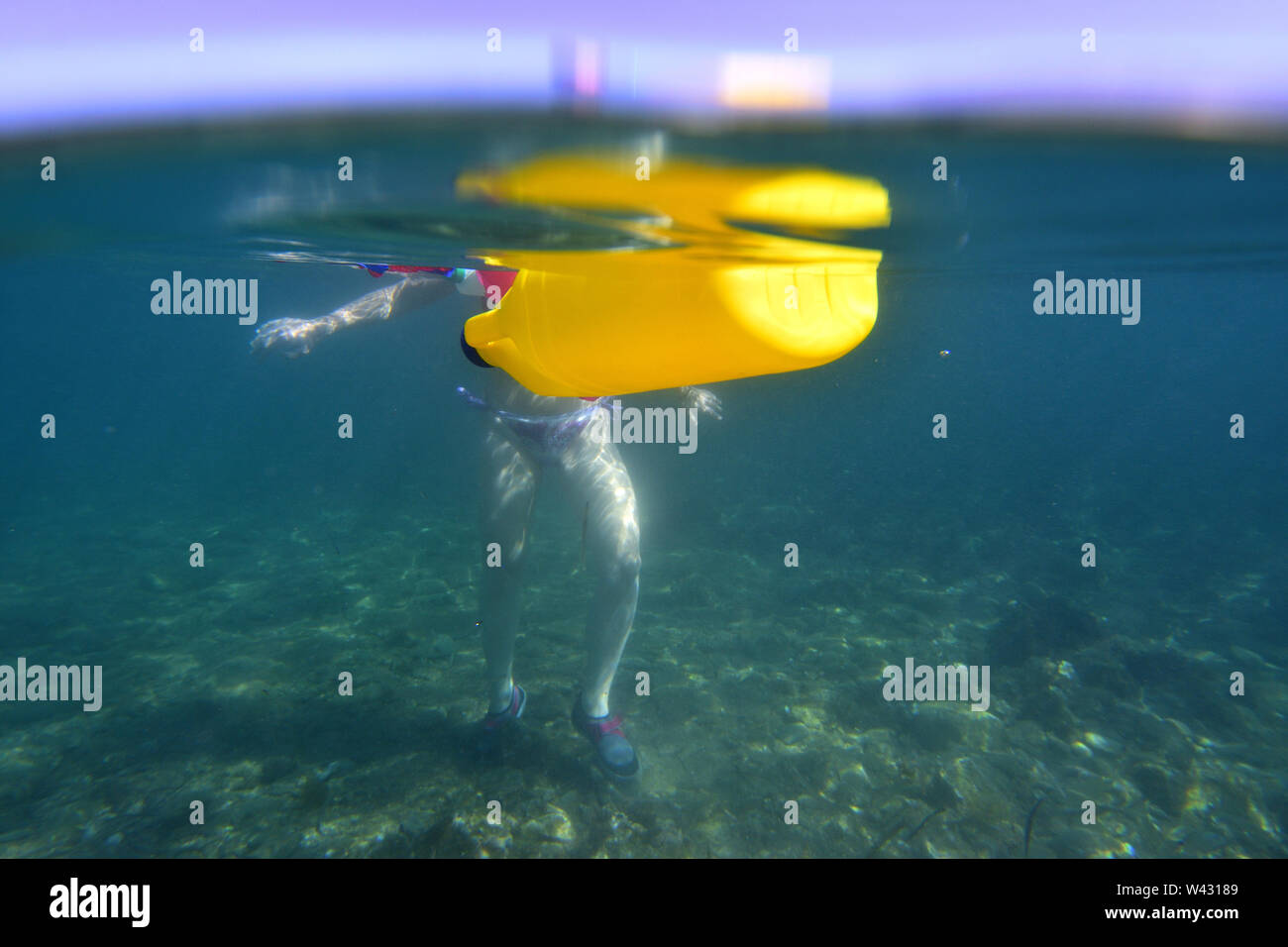 woman bathing in the sea with plastic Stock Photo - Alamy