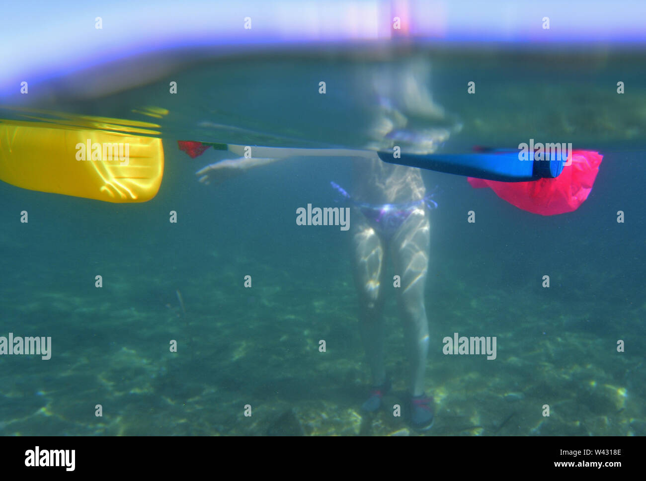 woman bathing in the sea with plastic Stock Photo - Alamy