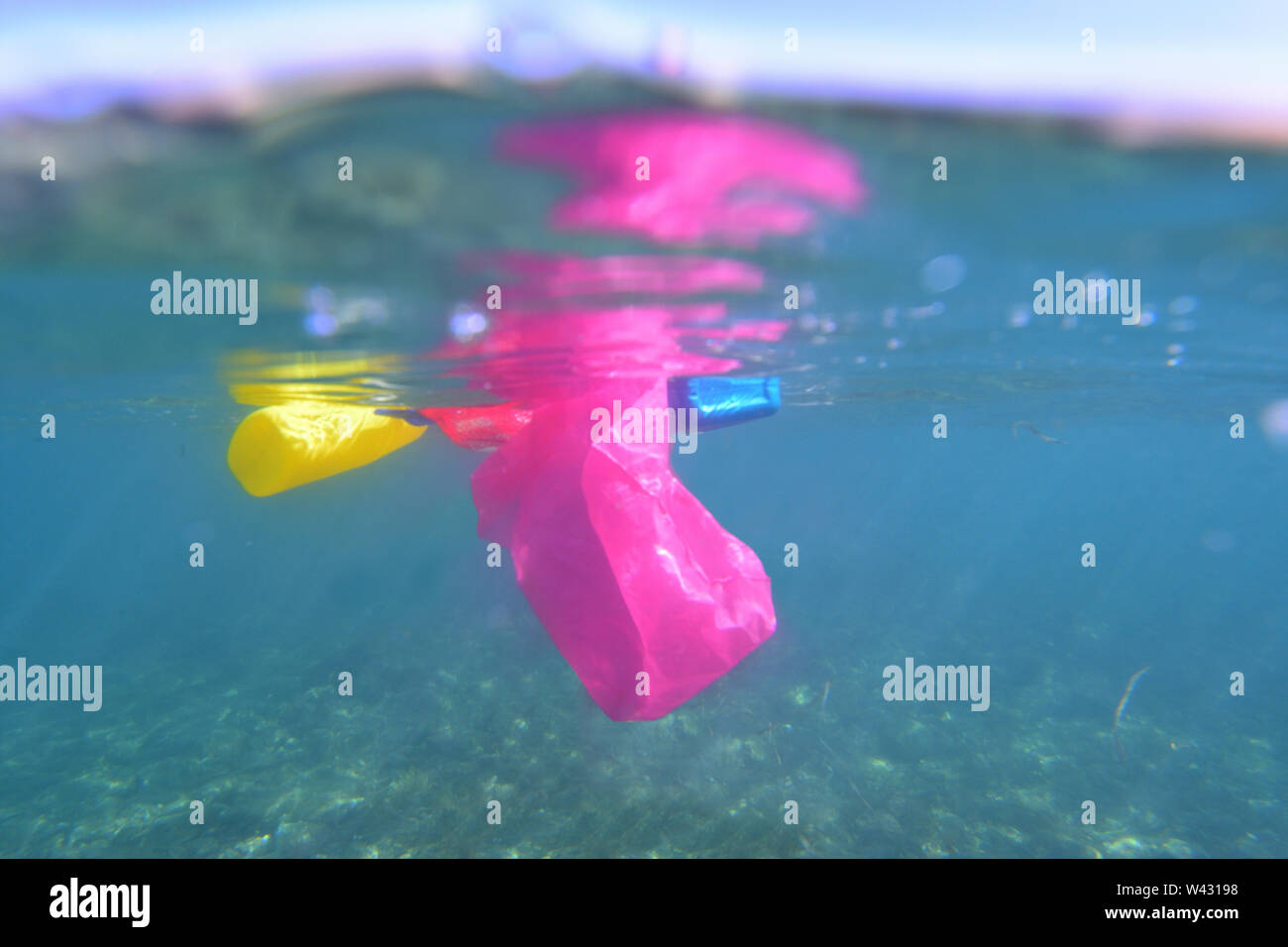 plastic bottle floating in the sea Stock Photo - Alamy