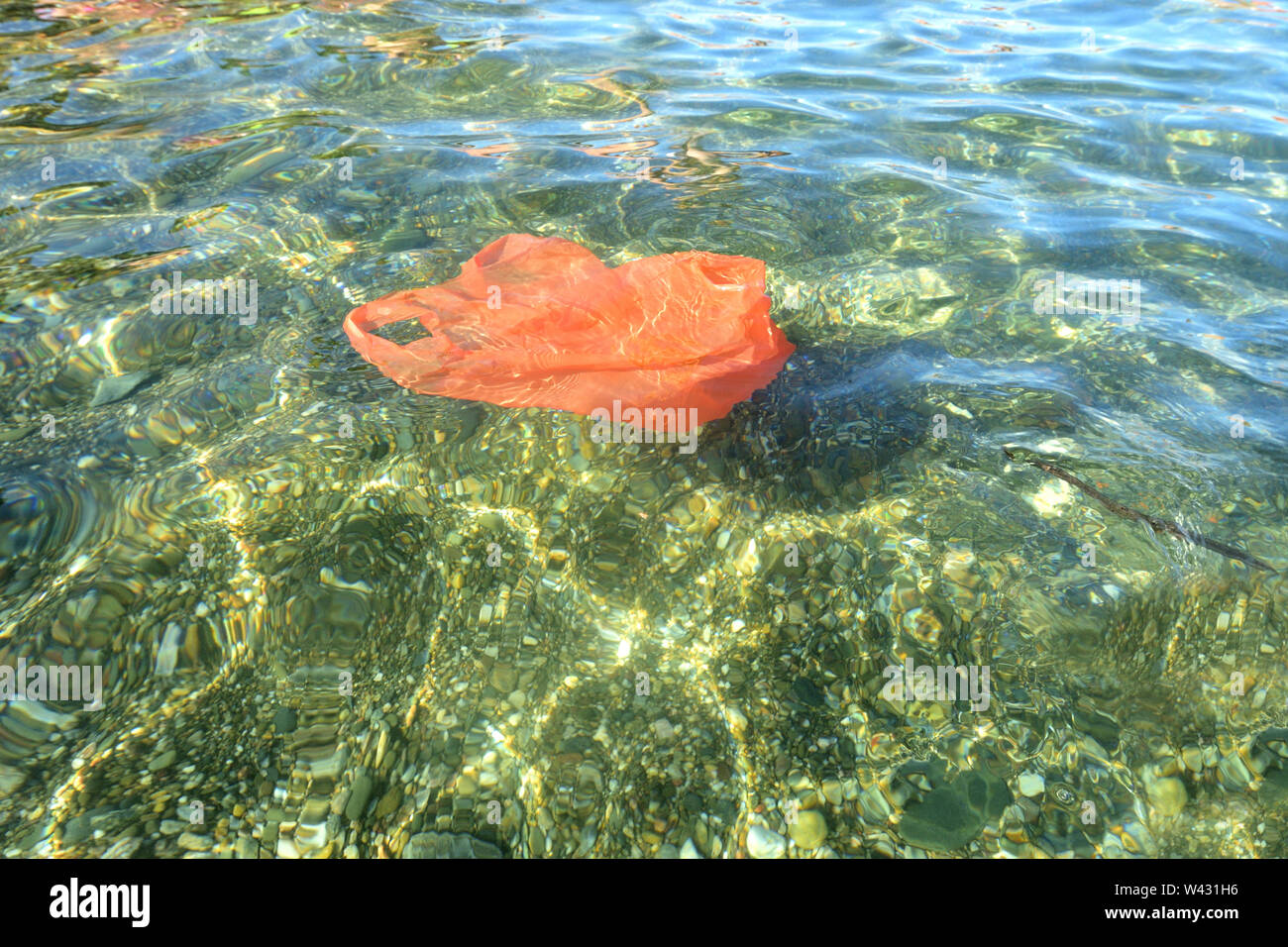 plastic bag floating in the sea Stock Photo - Alamy