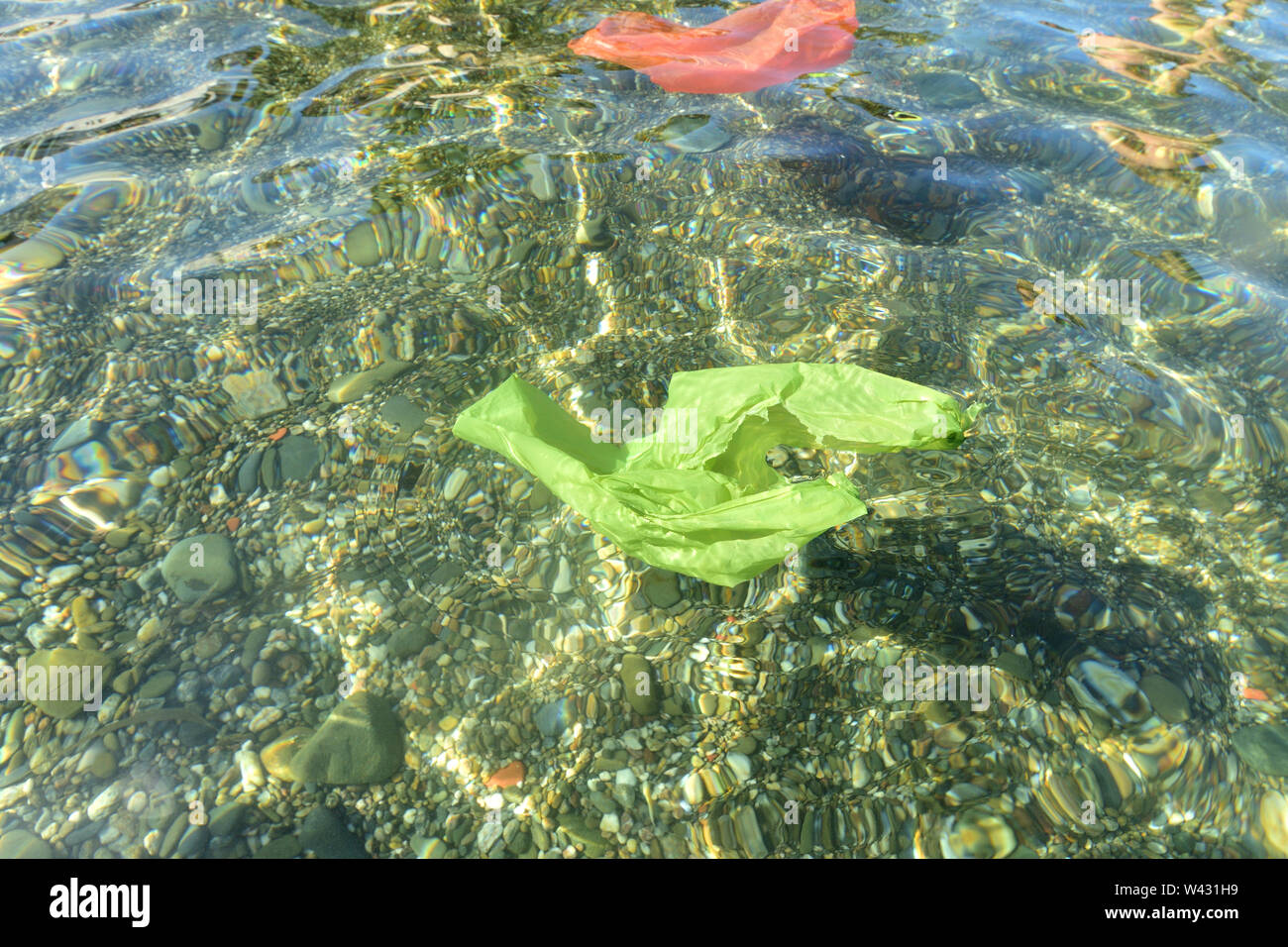 plastic bag floating in the sea Stock Photo - Alamy