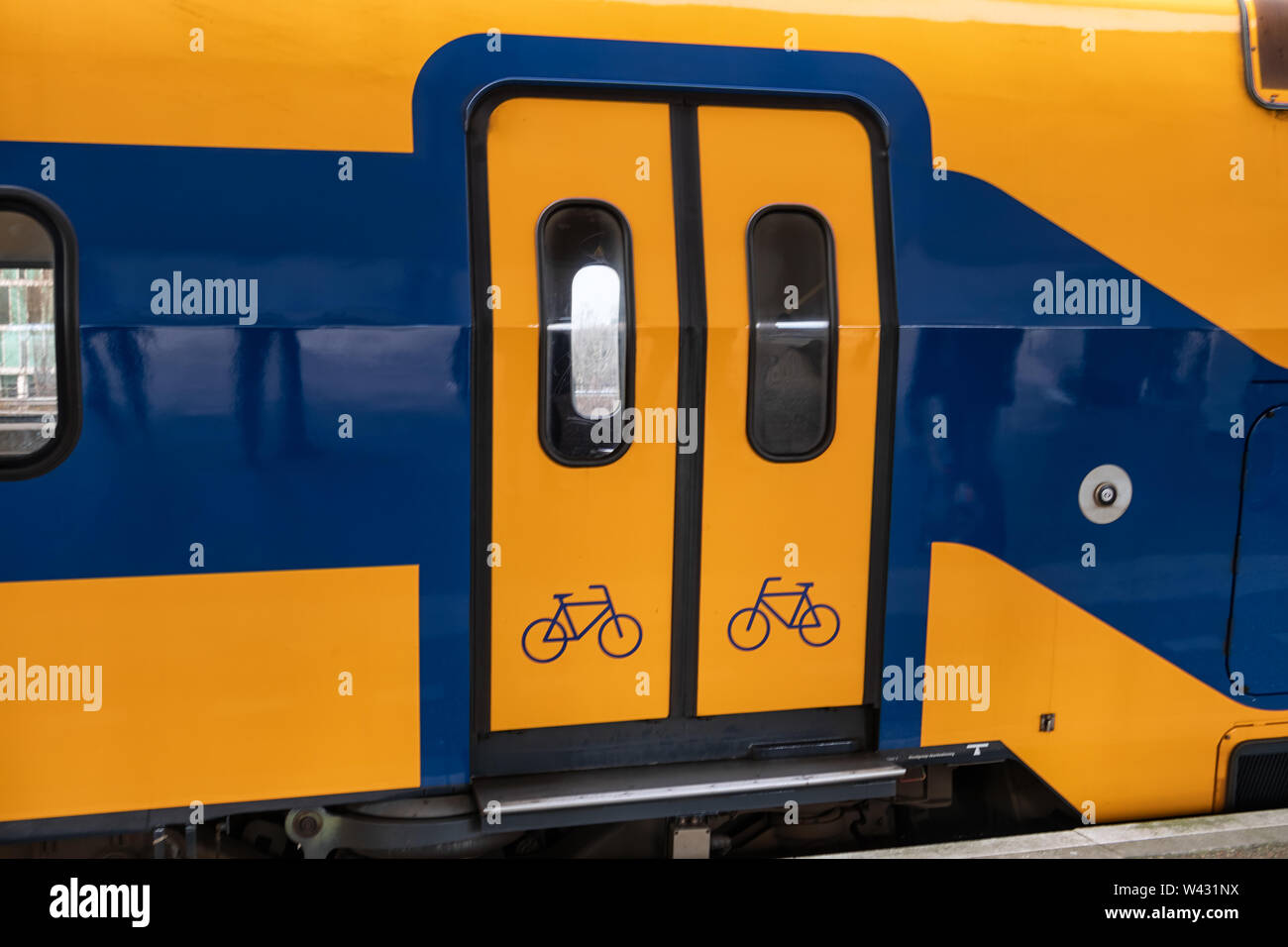 Train at Dutch railway platform with closed door Stock Photo - Alamy