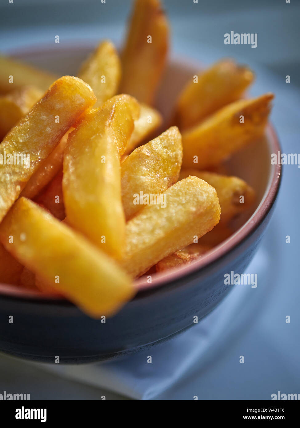 Bowl of fried chips Stock Photo - Alamy